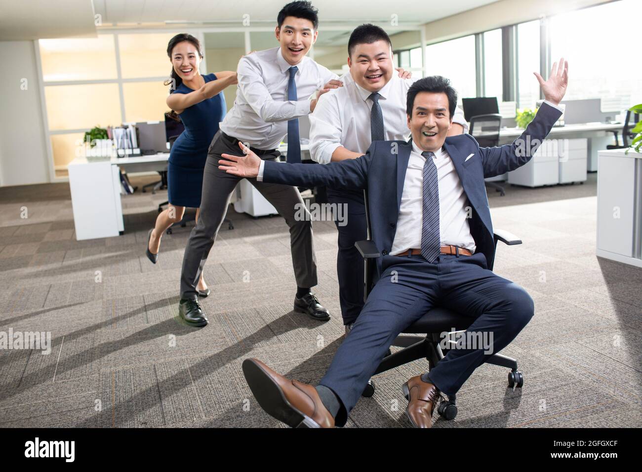 Business people playing in office Stock Photo - Alamy