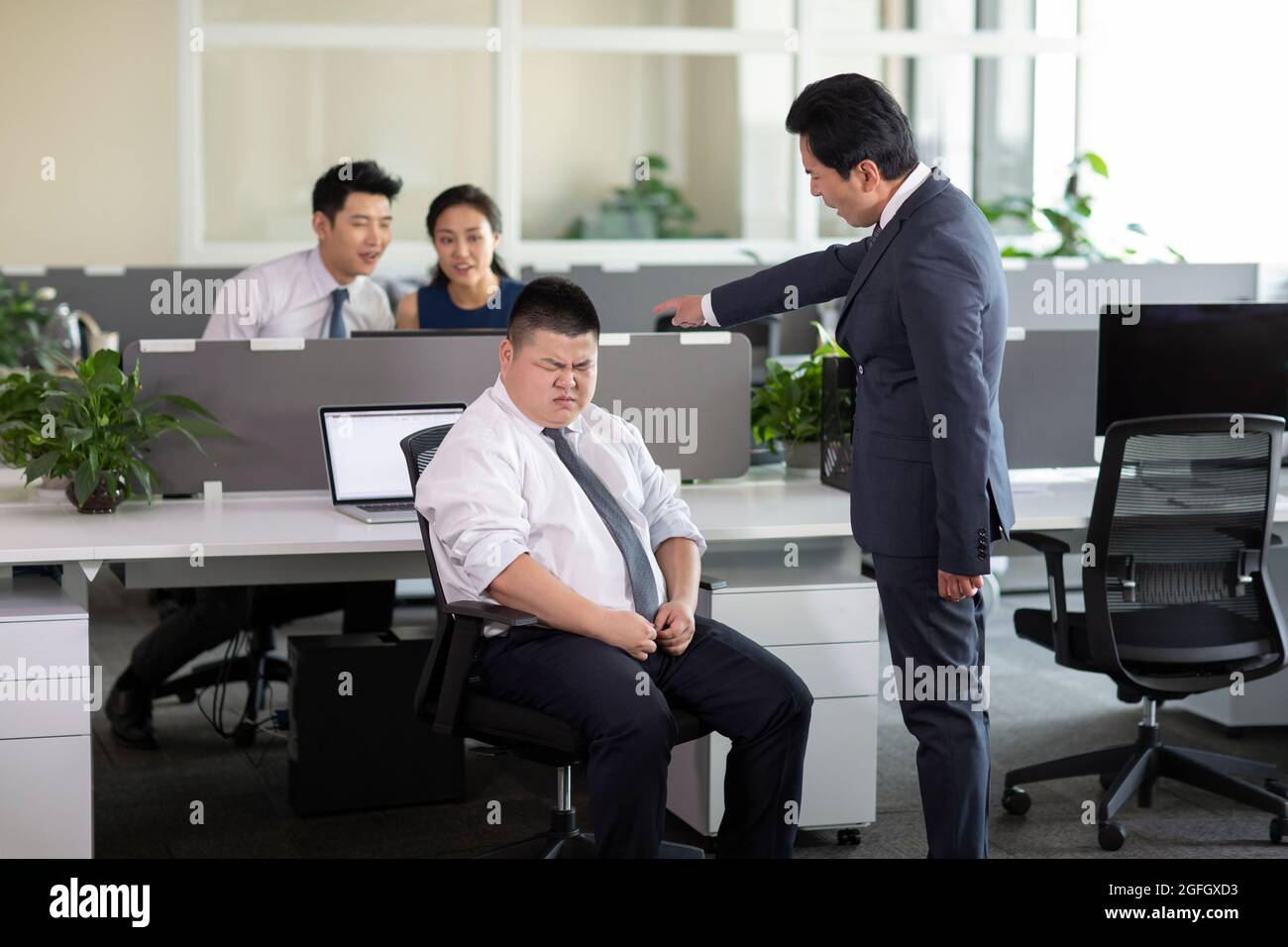 Manager scolding employee Stock Photo - Alamy