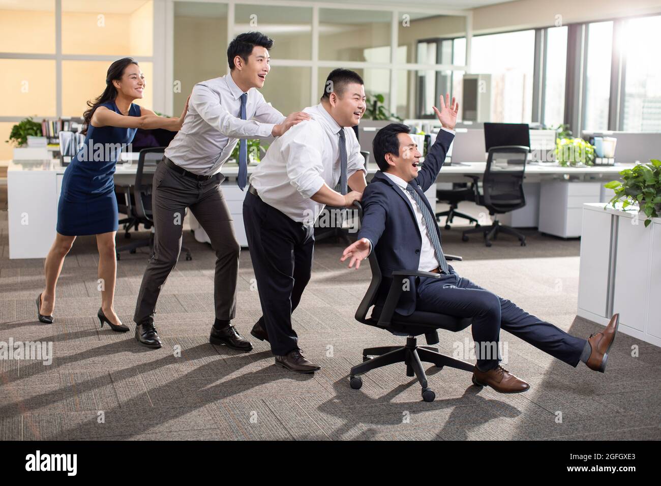 Business people playing in office Stock Photo - Alamy