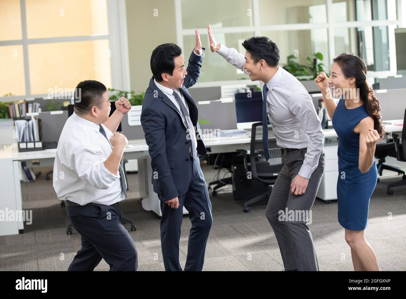 Business people celebrating in office Stock Photo - Alamy
