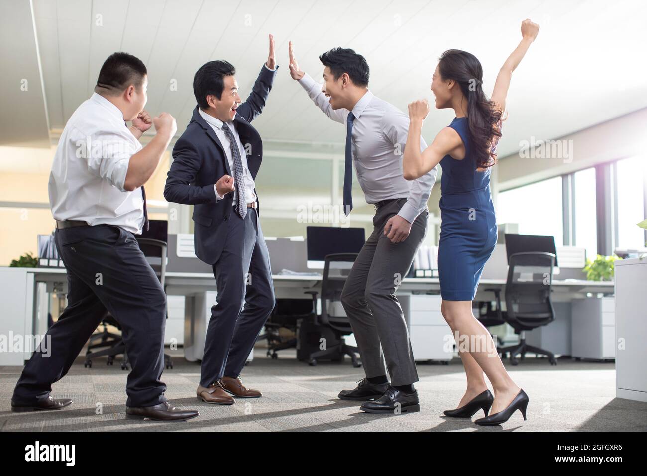 Business people celebrating in office Stock Photo - Alamy