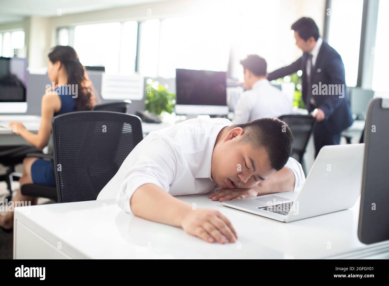 Businesswoman sleeping in office chair hi-res stock photography and ...