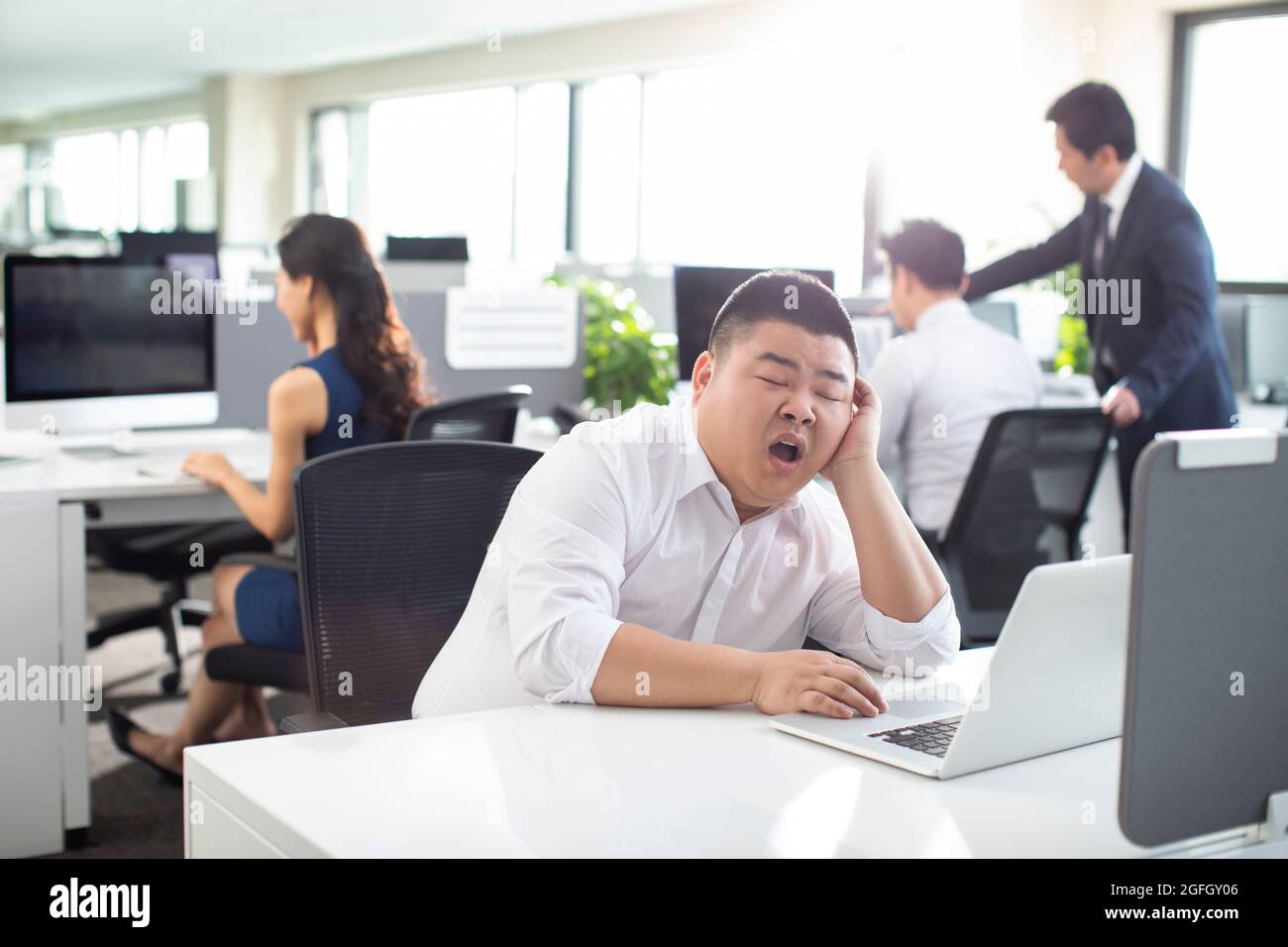 Businesswoman sleeping in office chair hi-res stock photography and ...
