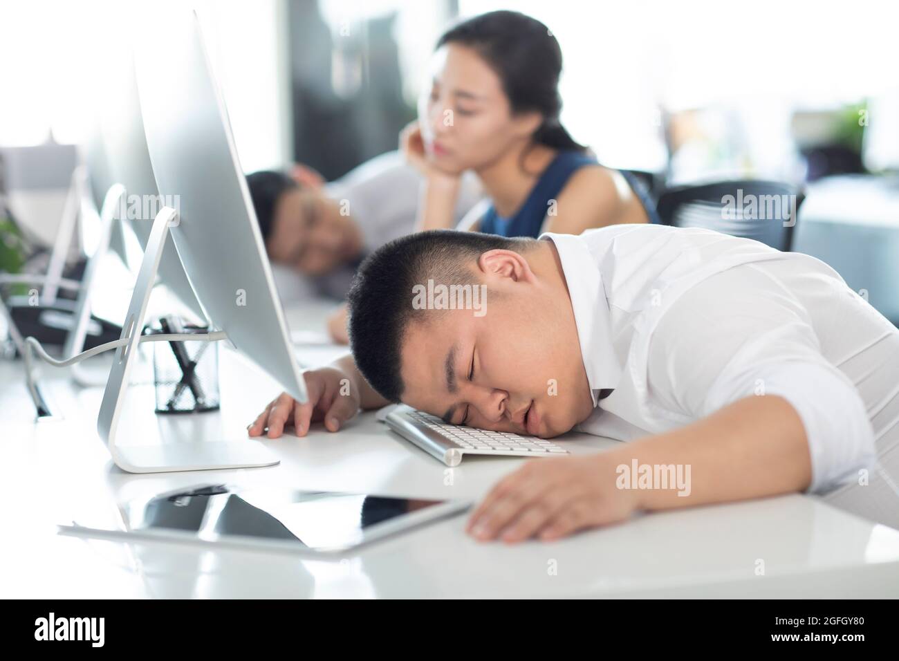 Business people sleeping in office Stock Photo - Alamy