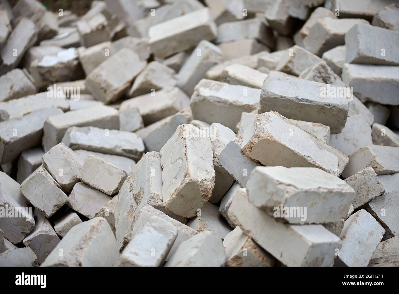 a dump of damaged gray bricks on the ruins Stock Photo - Alamy