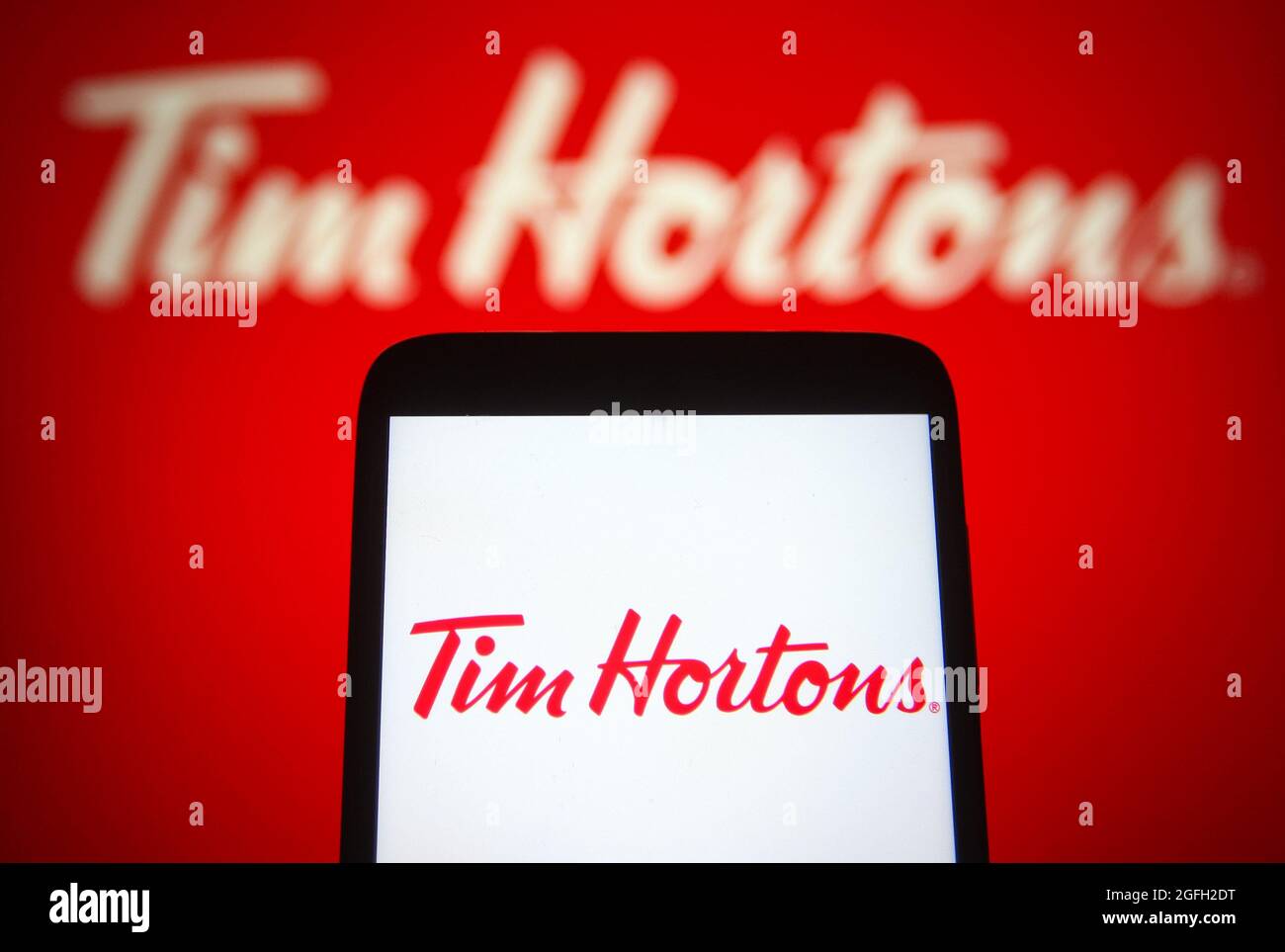 In this photo illustration a Tim Hortons logo of a multinational fast ...