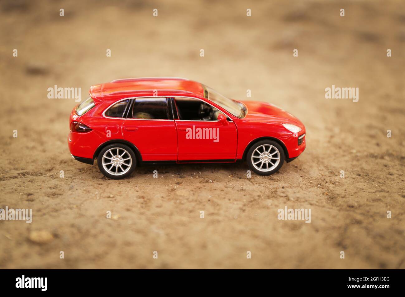 Close up of toy car on ground Stock Photo - Alamy