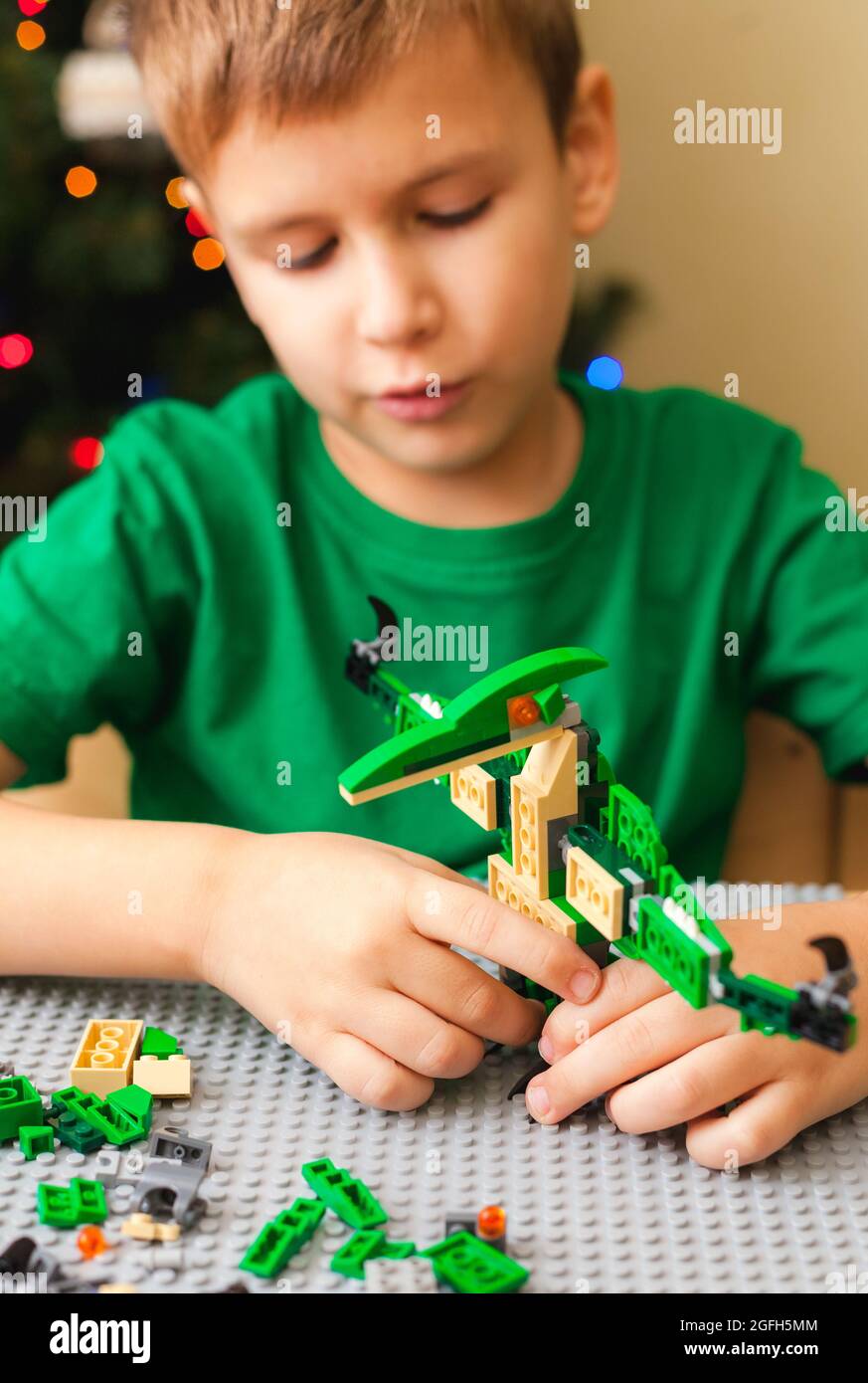 Saint-Petersburg, Russia - November 29, 2020 Cute boy collecting block ...