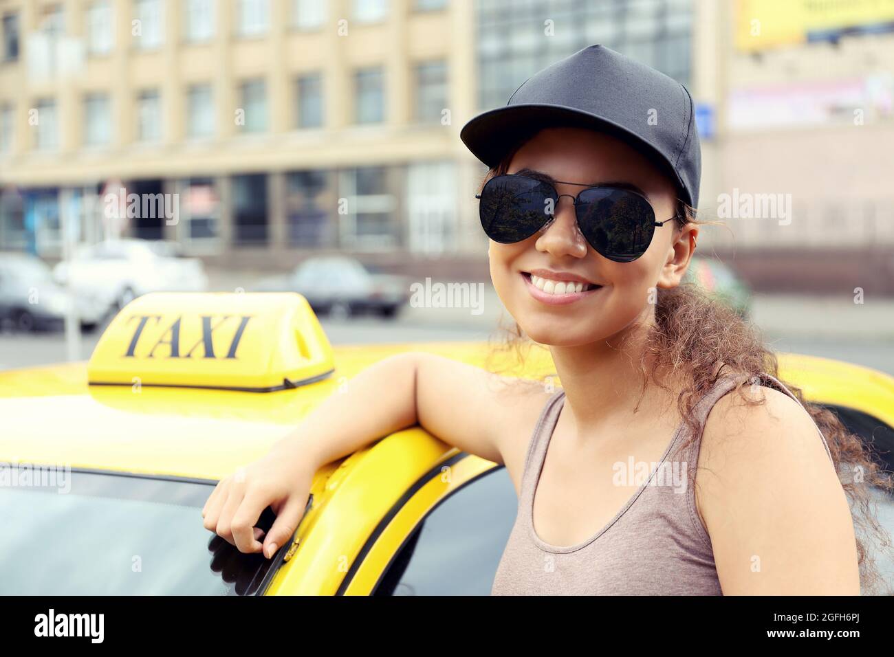 Female taxi driver near car Stock Photo - Alamy