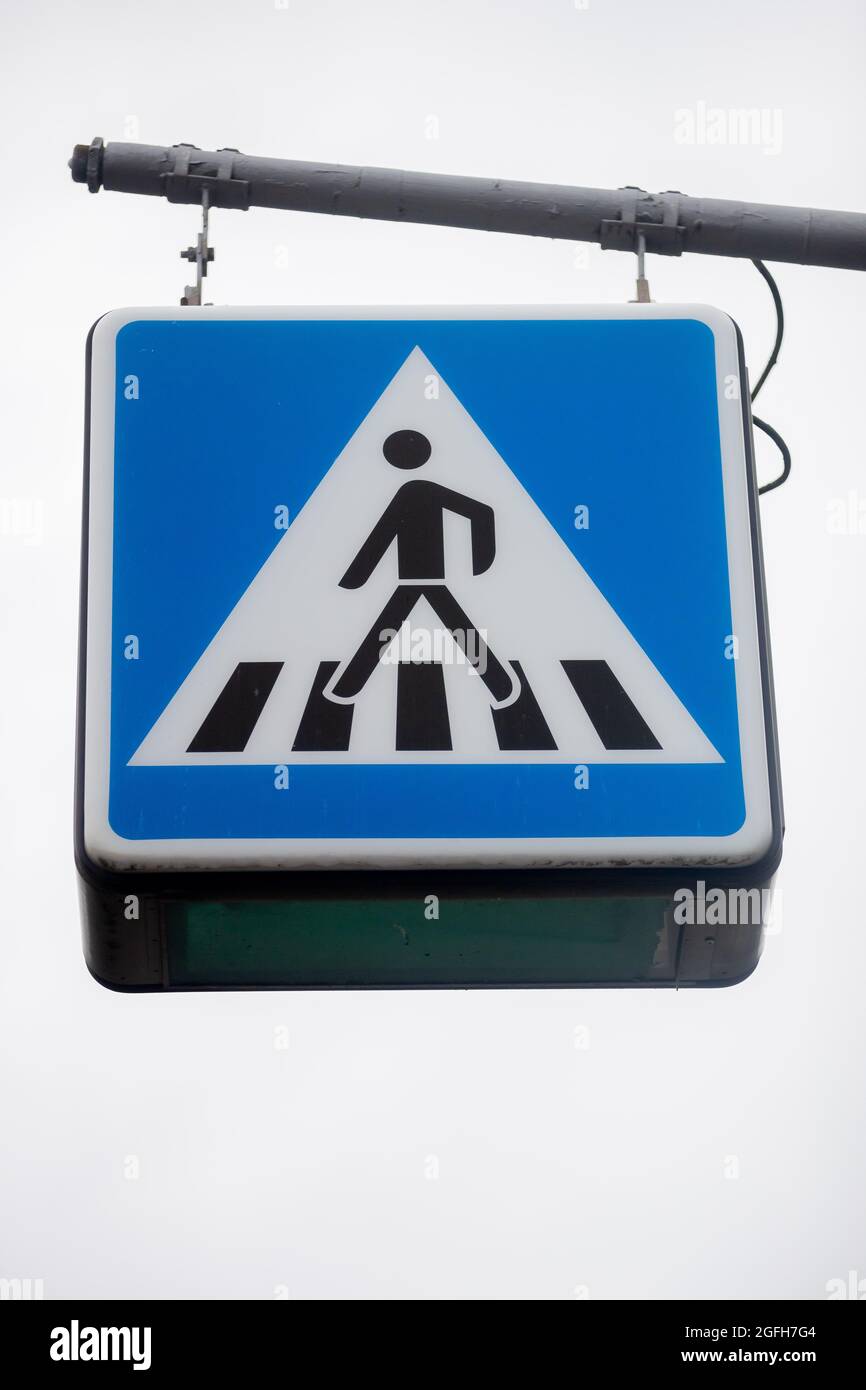 Berlin, Germany. 25th Aug, 2021. A sign for a pedestrian crossing hangs ...