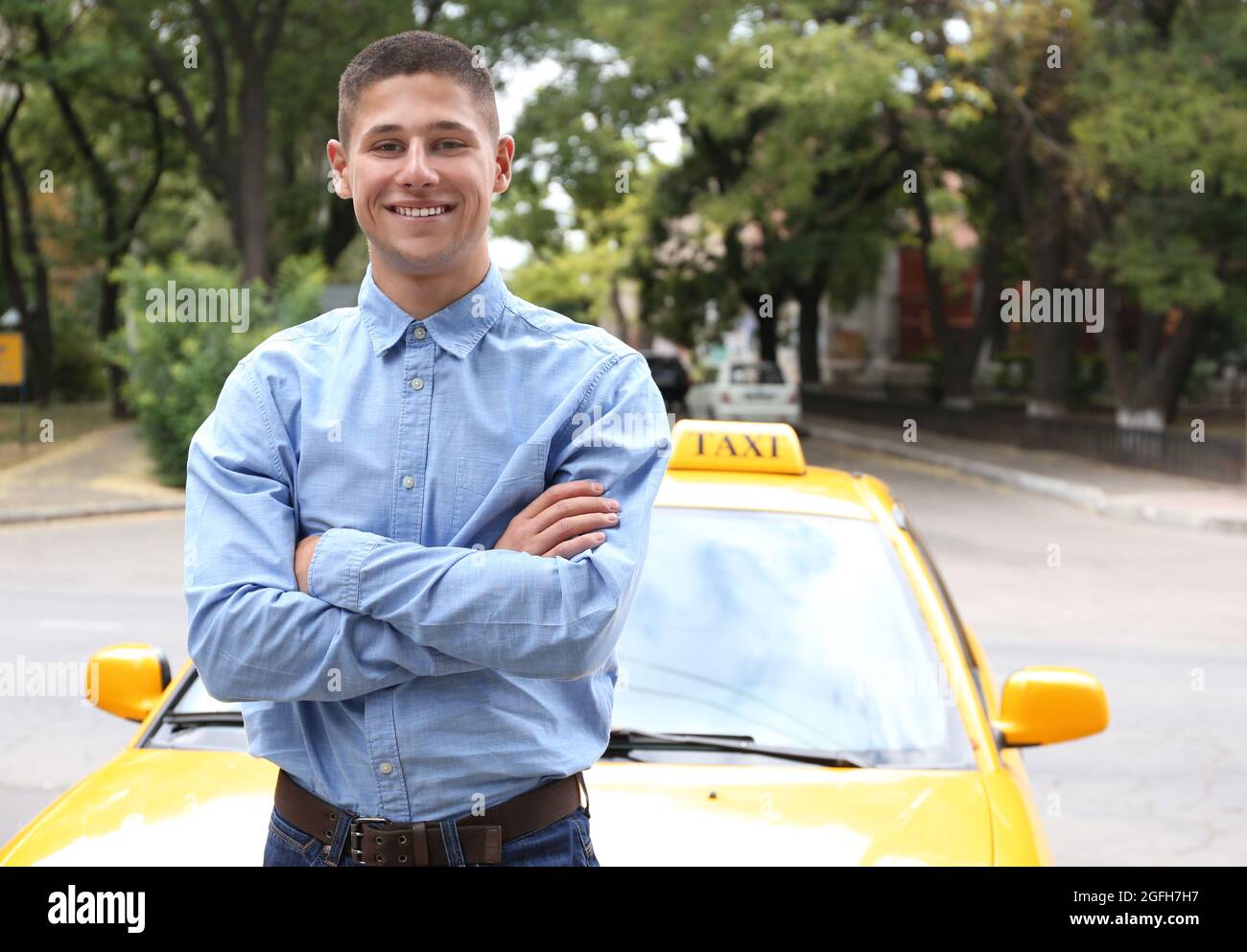 Male taxi driver near car Stock Photo - Alamy