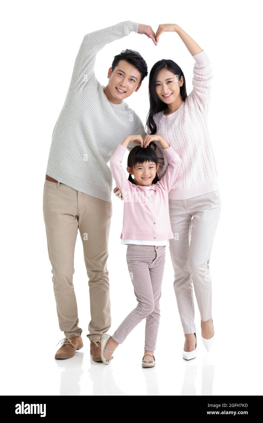 Happy young family making heart shape Stock Photo - Alamy
