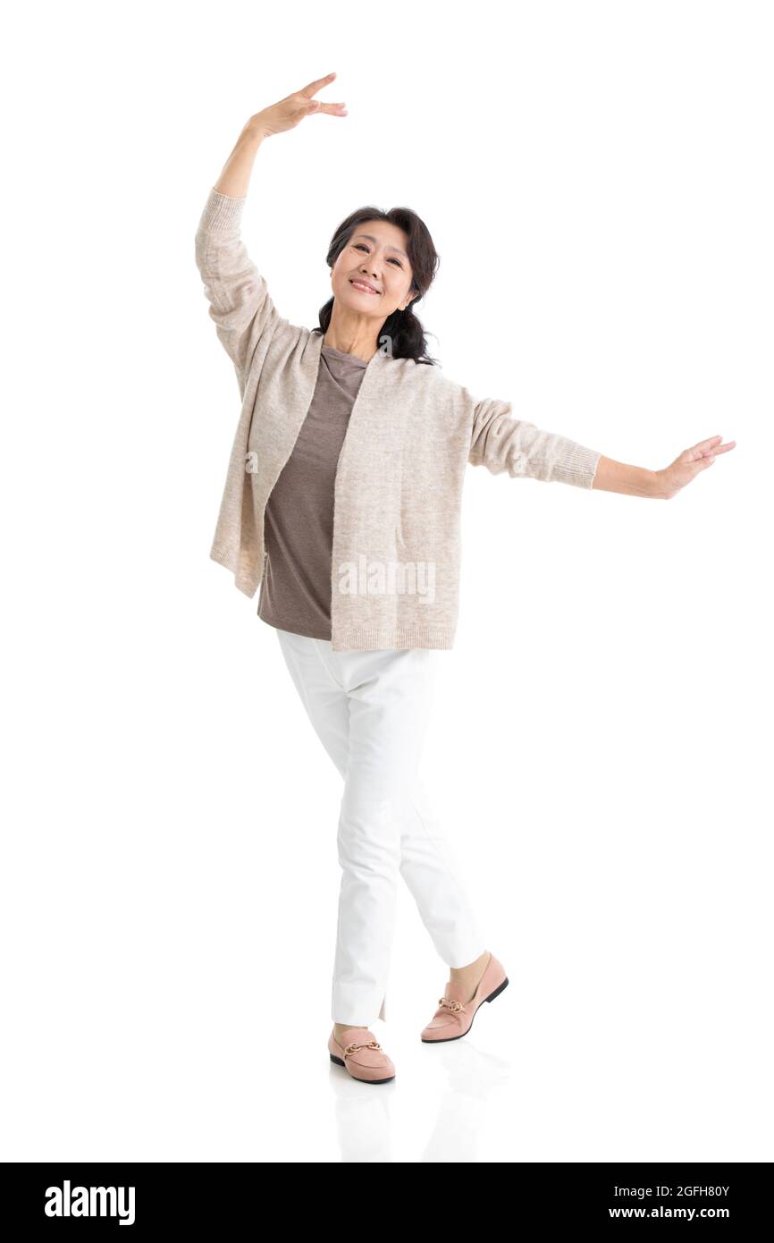 Happy senior woman dancing Stock Photo - Alamy