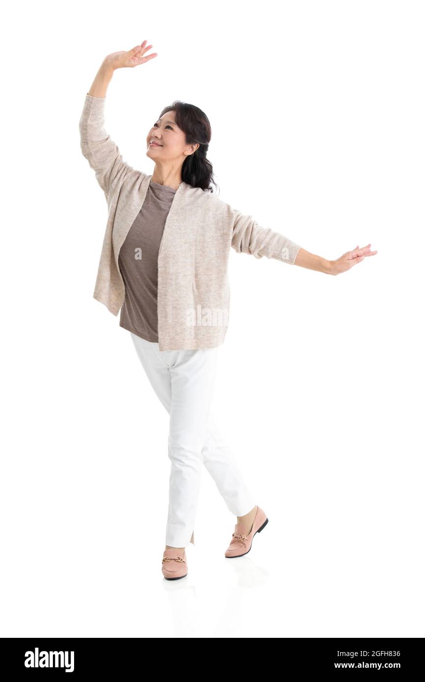 Happy senior woman dancing Stock Photo - Alamy