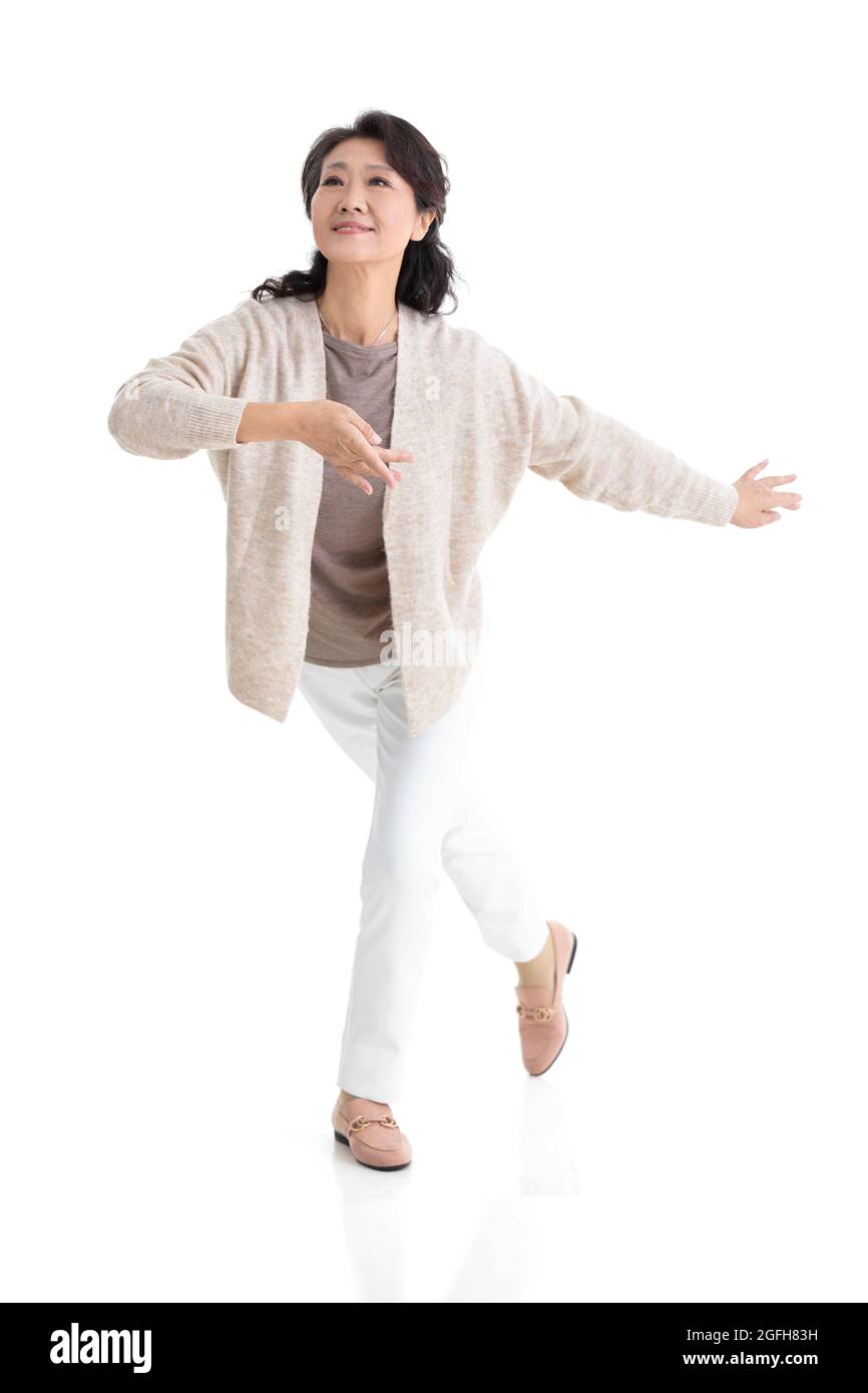 Happy senior woman dancing Stock Photo - Alamy