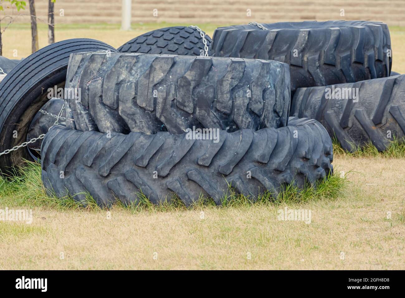 old tires used as a park art display in city Stock Photo - Alamy
