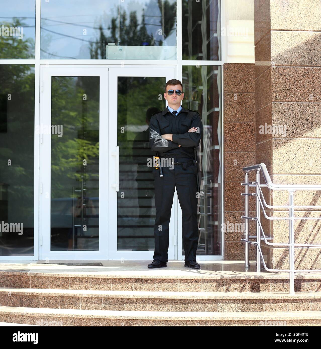 Male security guard outdoors Stock Photo - Alamy