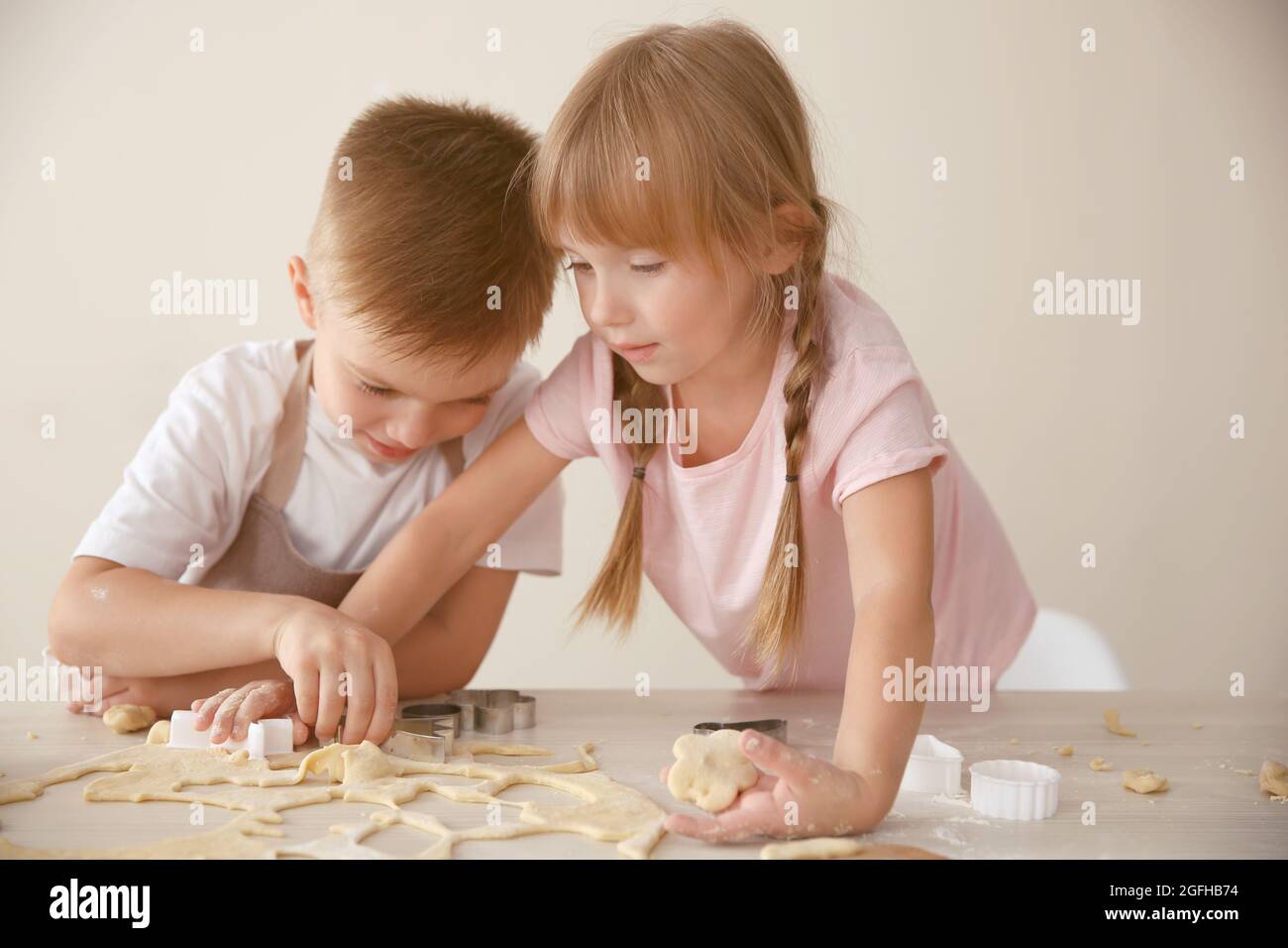 Kids making biscuits in kitchen Stock Photo - Alamy