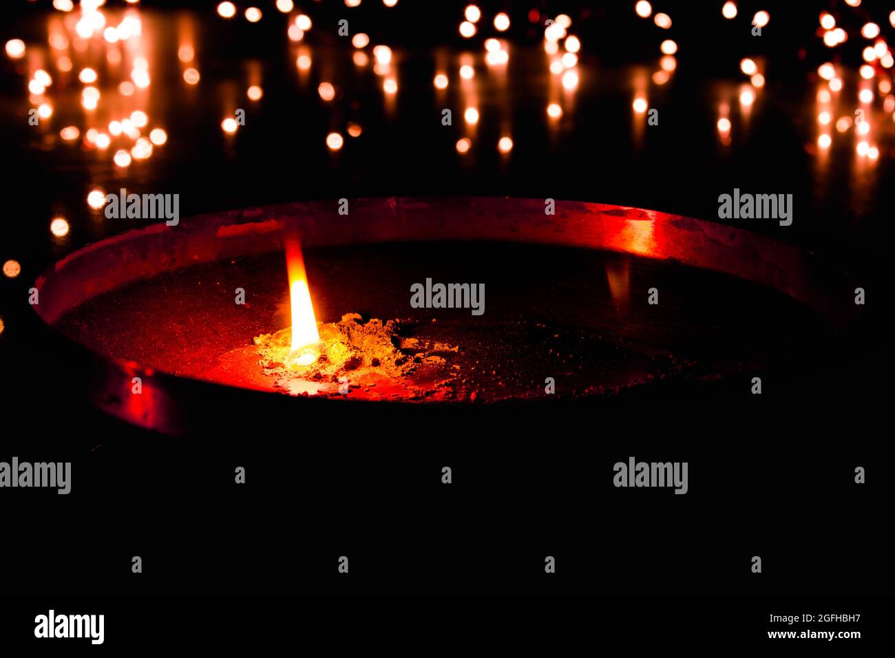 Plate with burning camphor and sacred ash during the prayer commonly ...