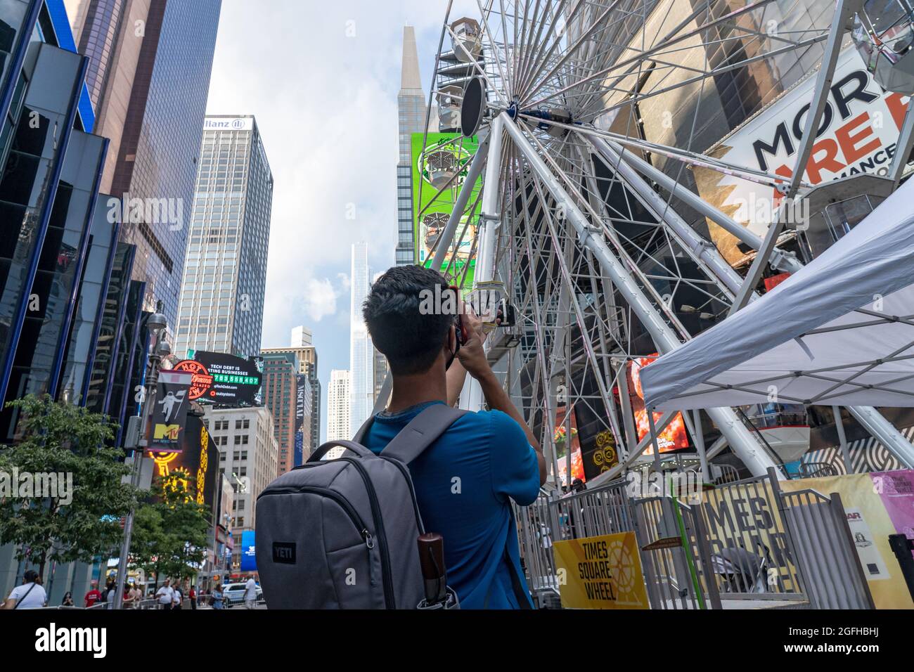 NEW YORK, NY - AUGUST 25: People visit the Times Square Ferris wheel on ...