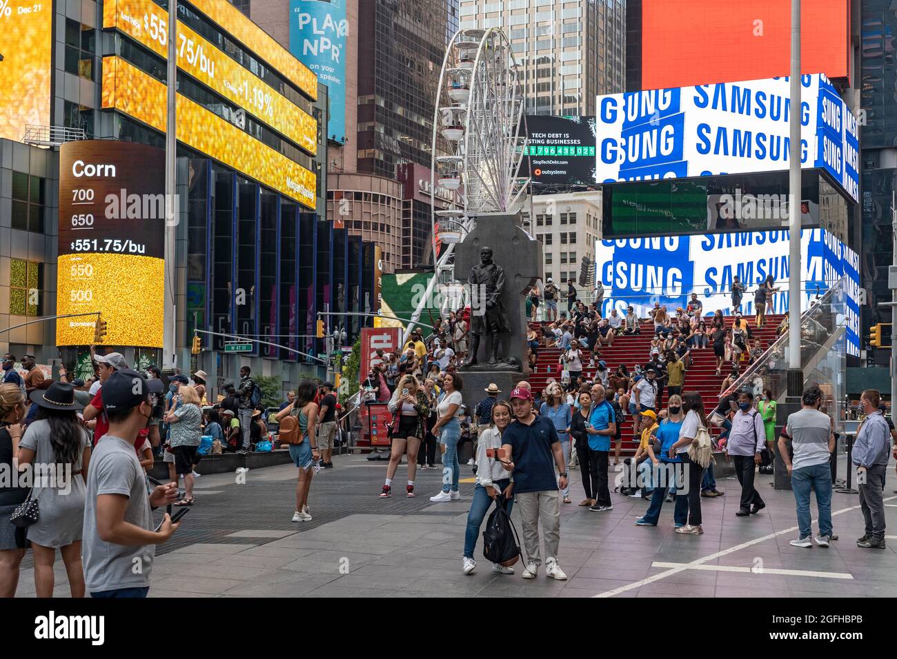 NEW YORK, NY - AUGUST 25: People gather in Times Square with the Times ...
