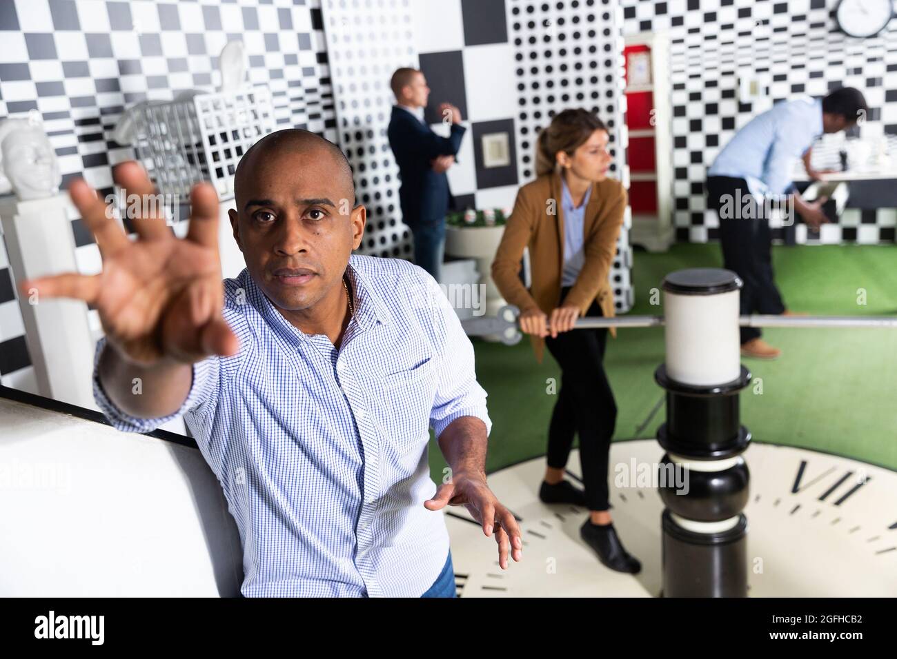 Quest player is looking for a key to exit room Stock Photo - Alamy