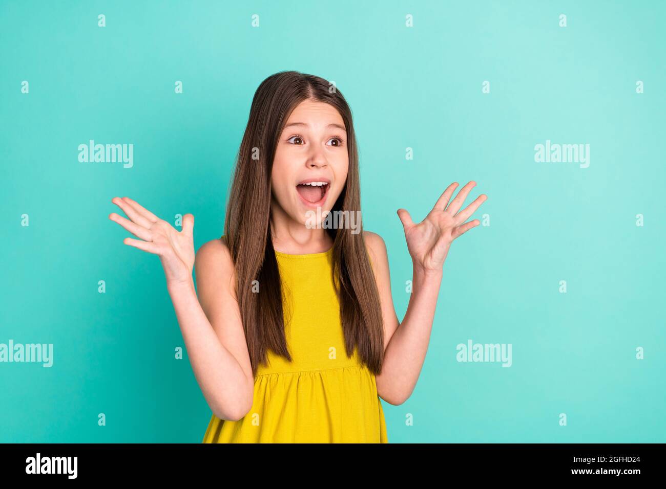 Photo of impressed nice brown hair girl look empty space wear yellow ...