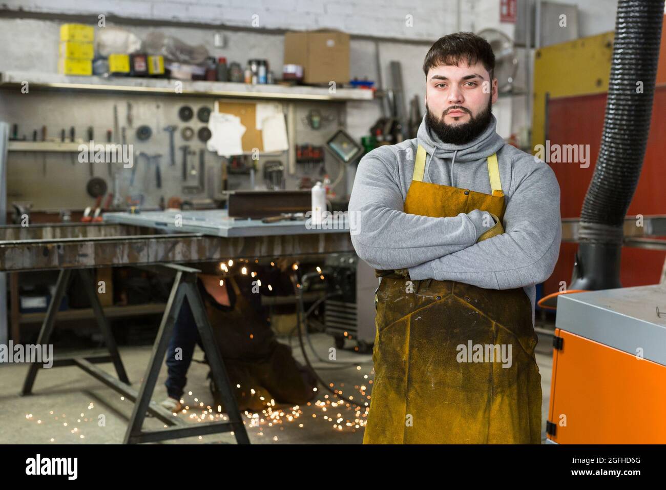 Proffessional young man engineer posing during work Stock Photo - Alamy