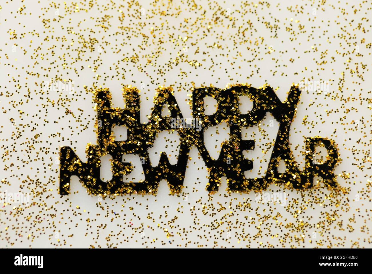 New Year. Festive gold background.New Year lettering in gold glitter ...