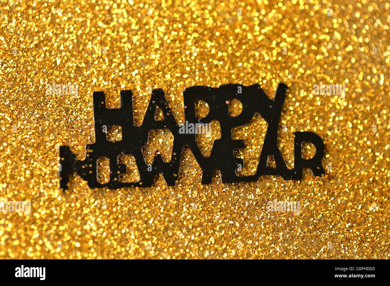 Happy New Year. Festive gold background.New Year lettering in gold ...