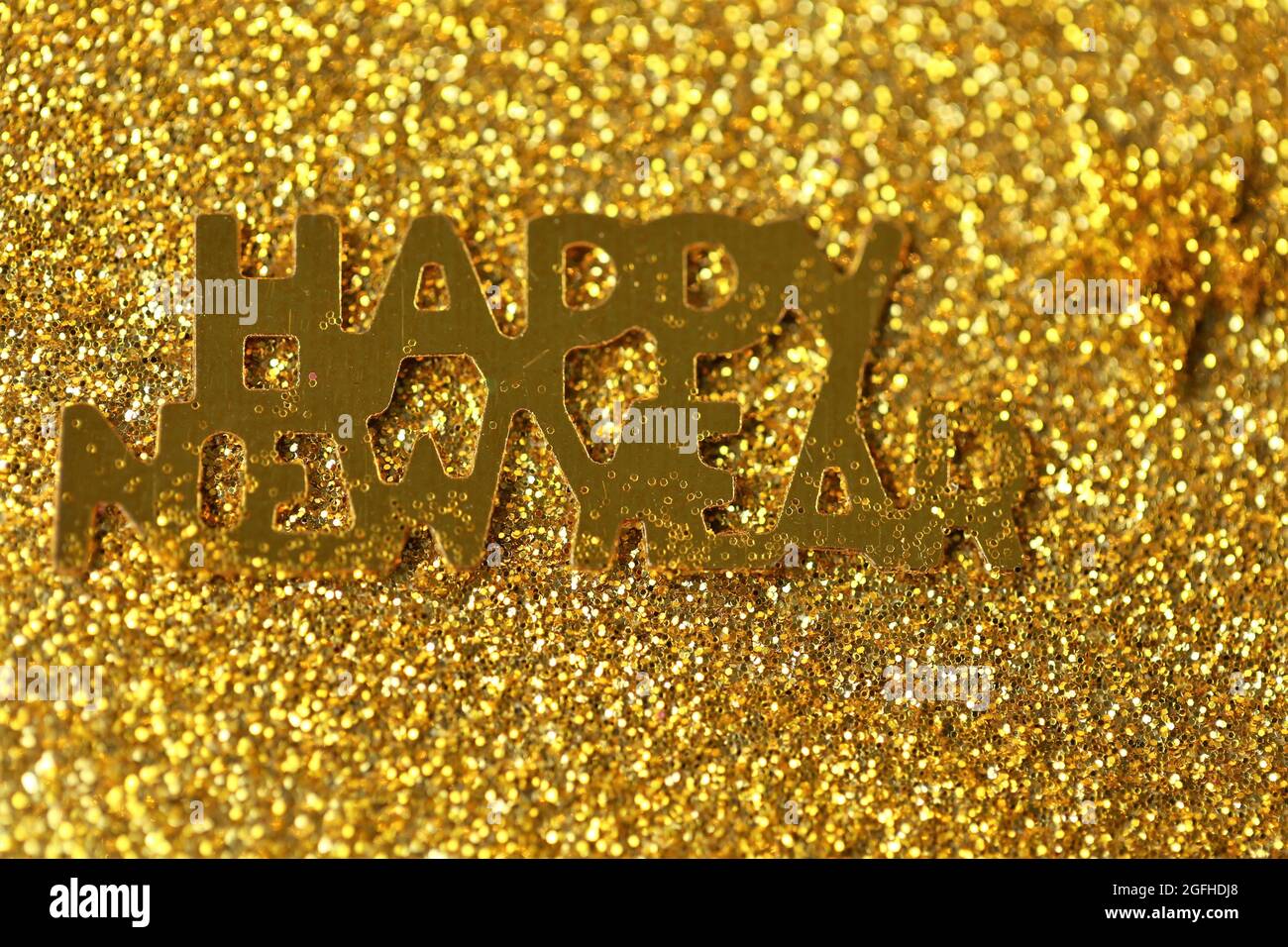 Happy New Year background.New Year lettering in gold glitter.Winter ...
