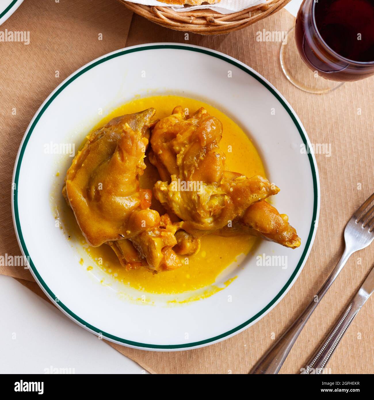 Appetizing fried pig legs with potatoes served on plate Stock Photo - Alamy