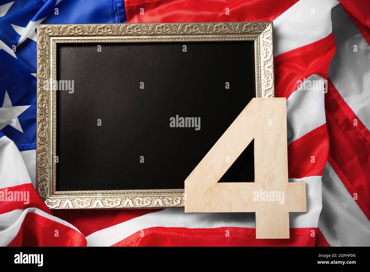Independence day concept. Number 4 and blank frame on American flag ...