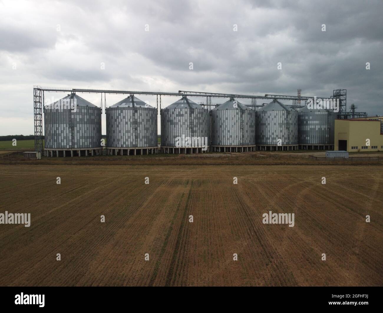 Grain elevator. Metal grain elevator in agricultural zone. Agriculture storage for harvest ...