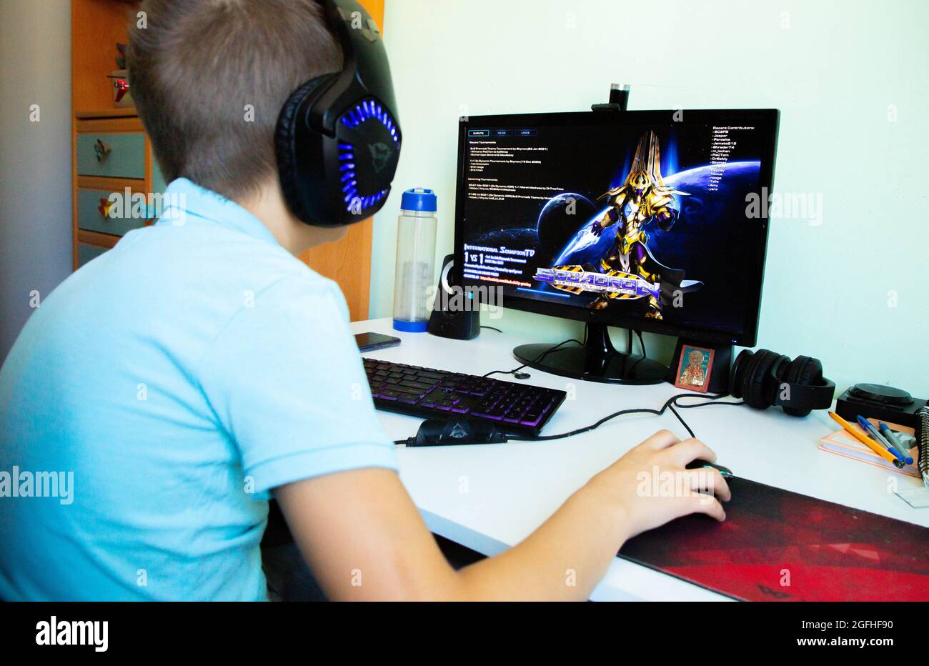 a boy plays in computer game Stock Photo - Alamy