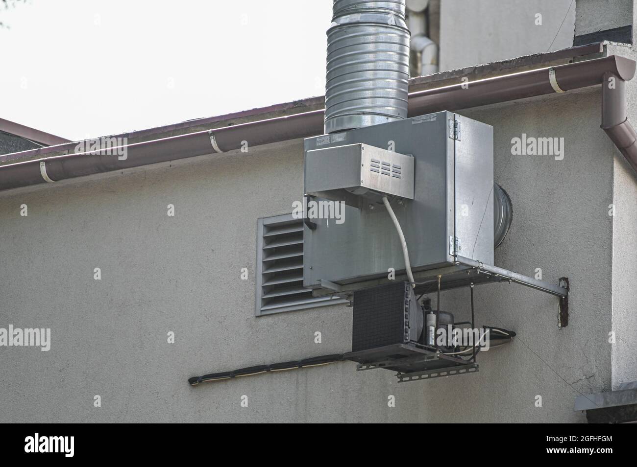 Ventilation system installed on the wall of an industrial building ...