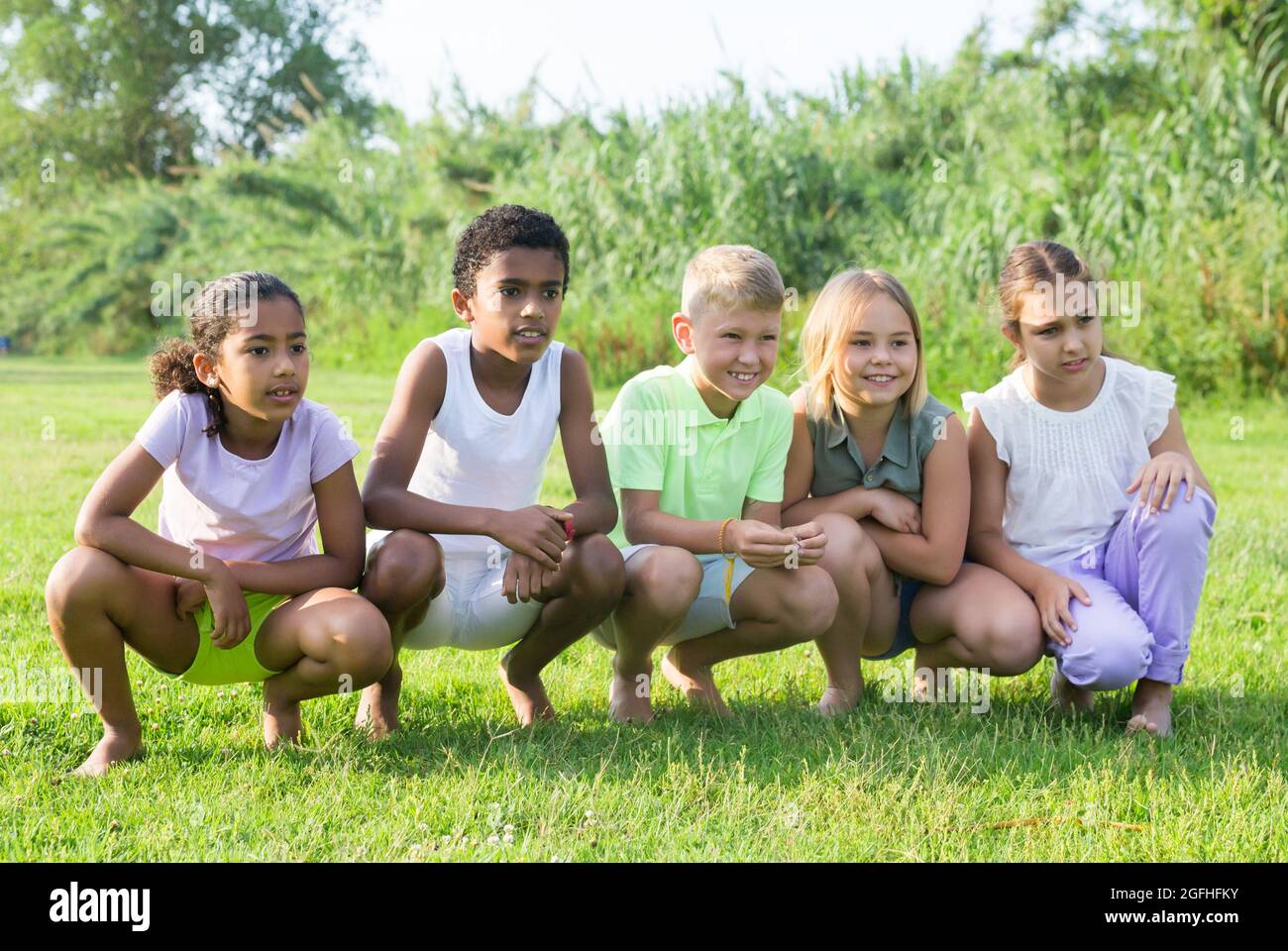 Children on grass Stock Photo - Alamy