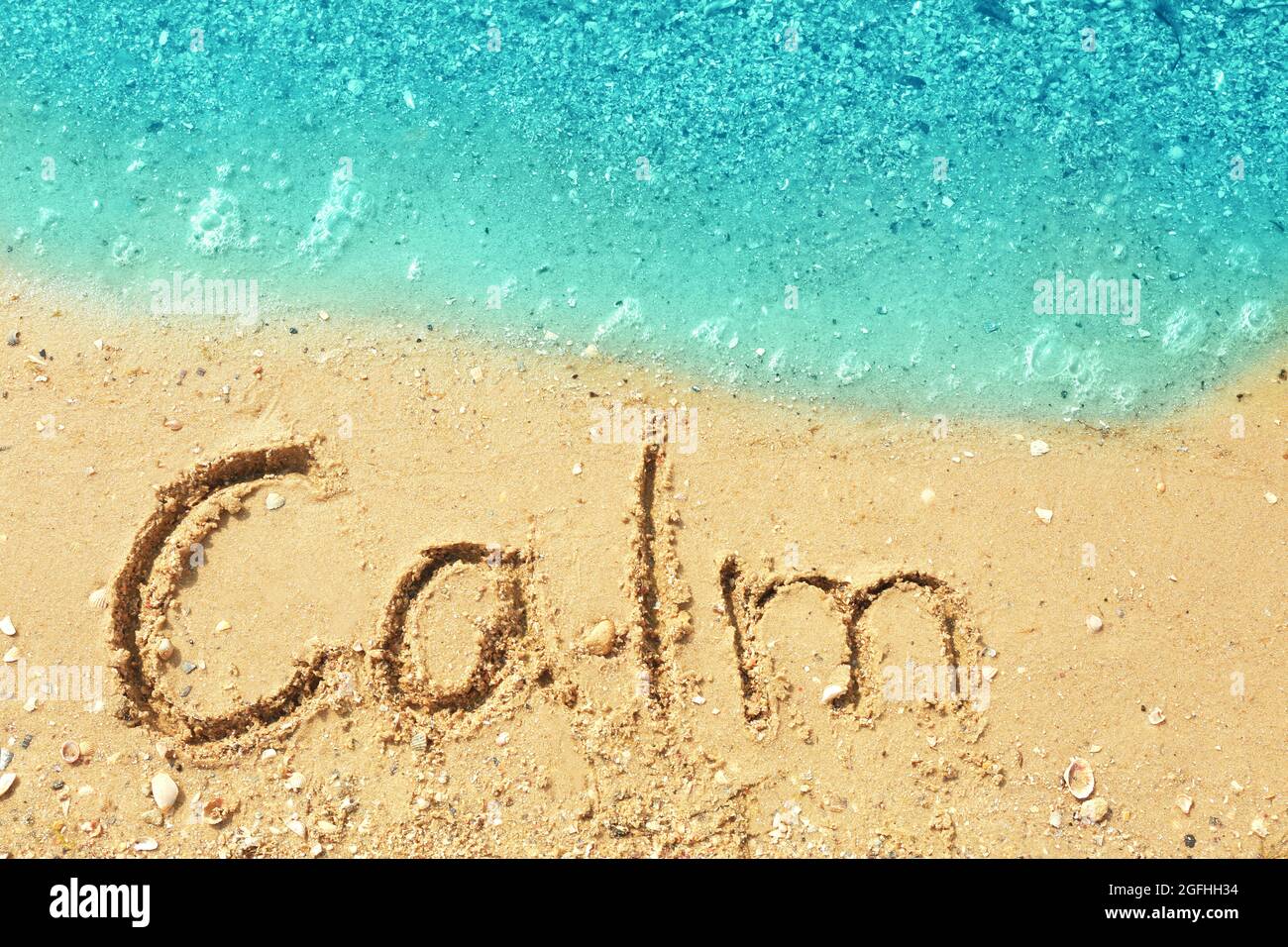 Word CALM on beach sand Stock Photo - Alamy