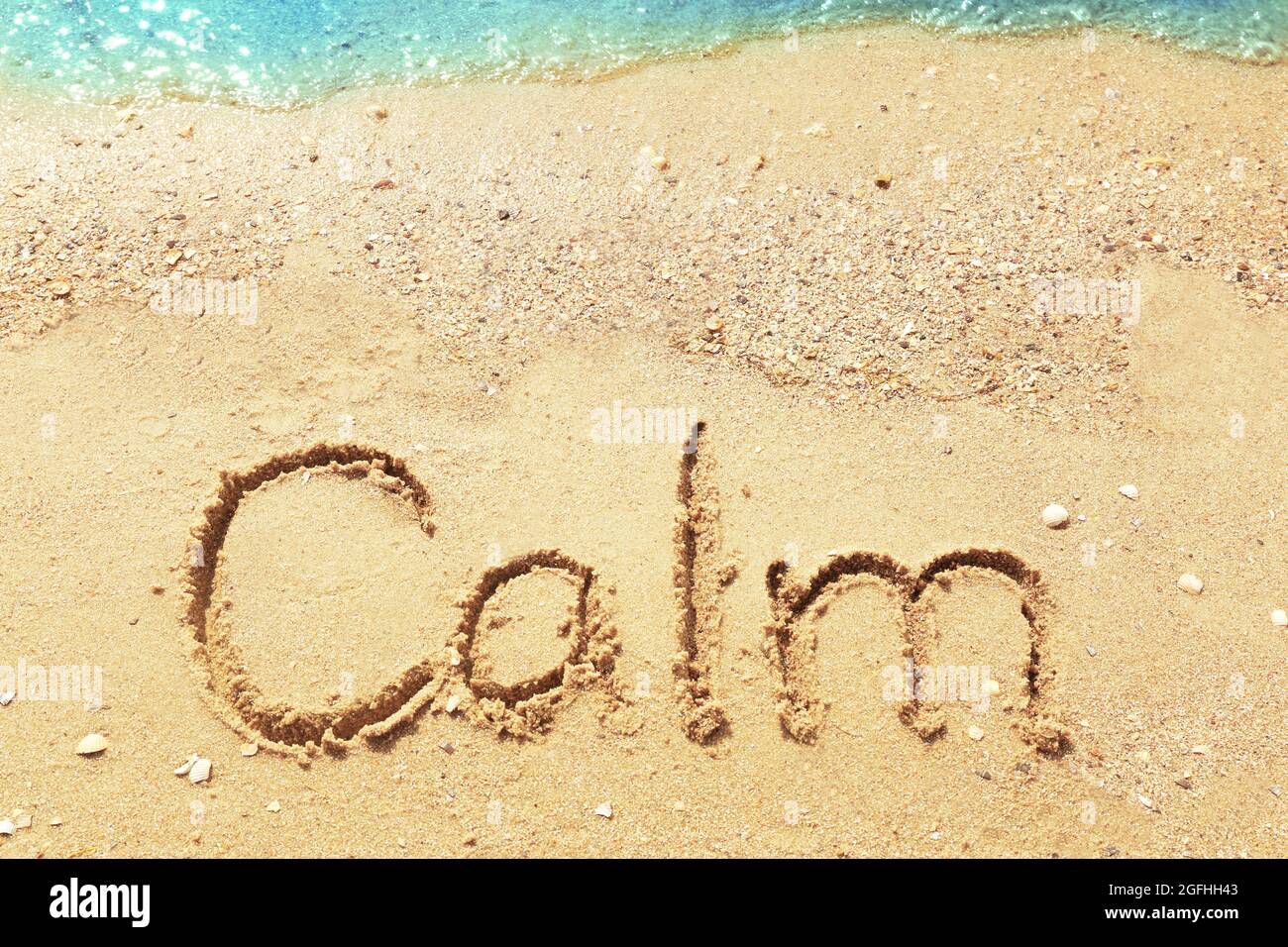 Word CALM on beach sand Stock Photo - Alamy