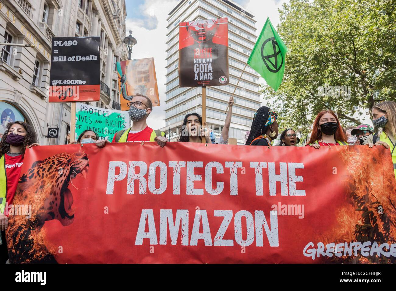 Protesters hold a banner expressing their opinions during the ...