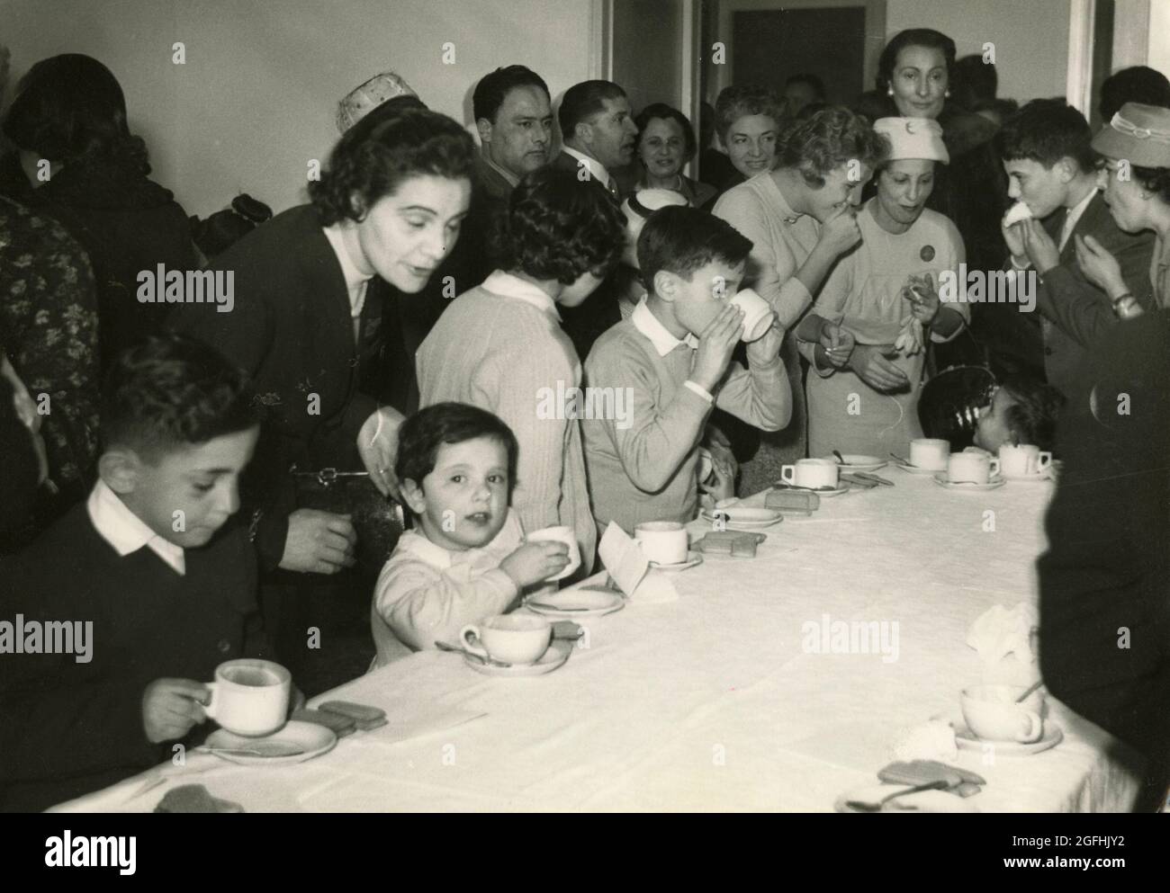 Children and parents at a tea party, Italy 1957 Stock Photo - Alamy