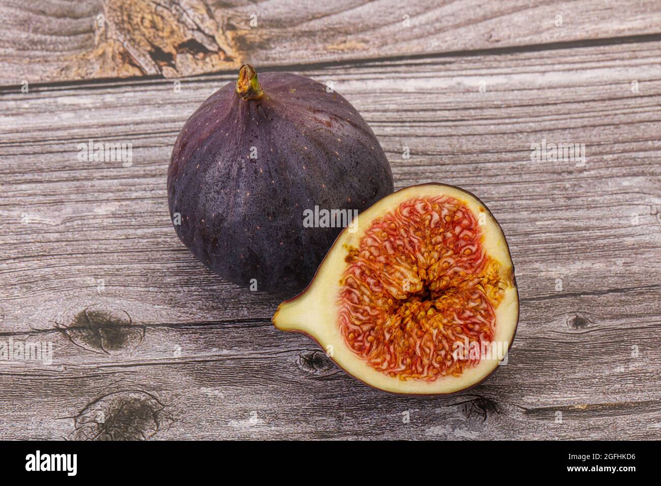 Sweet purple slice of fig fruit Stock Photo - Alamy