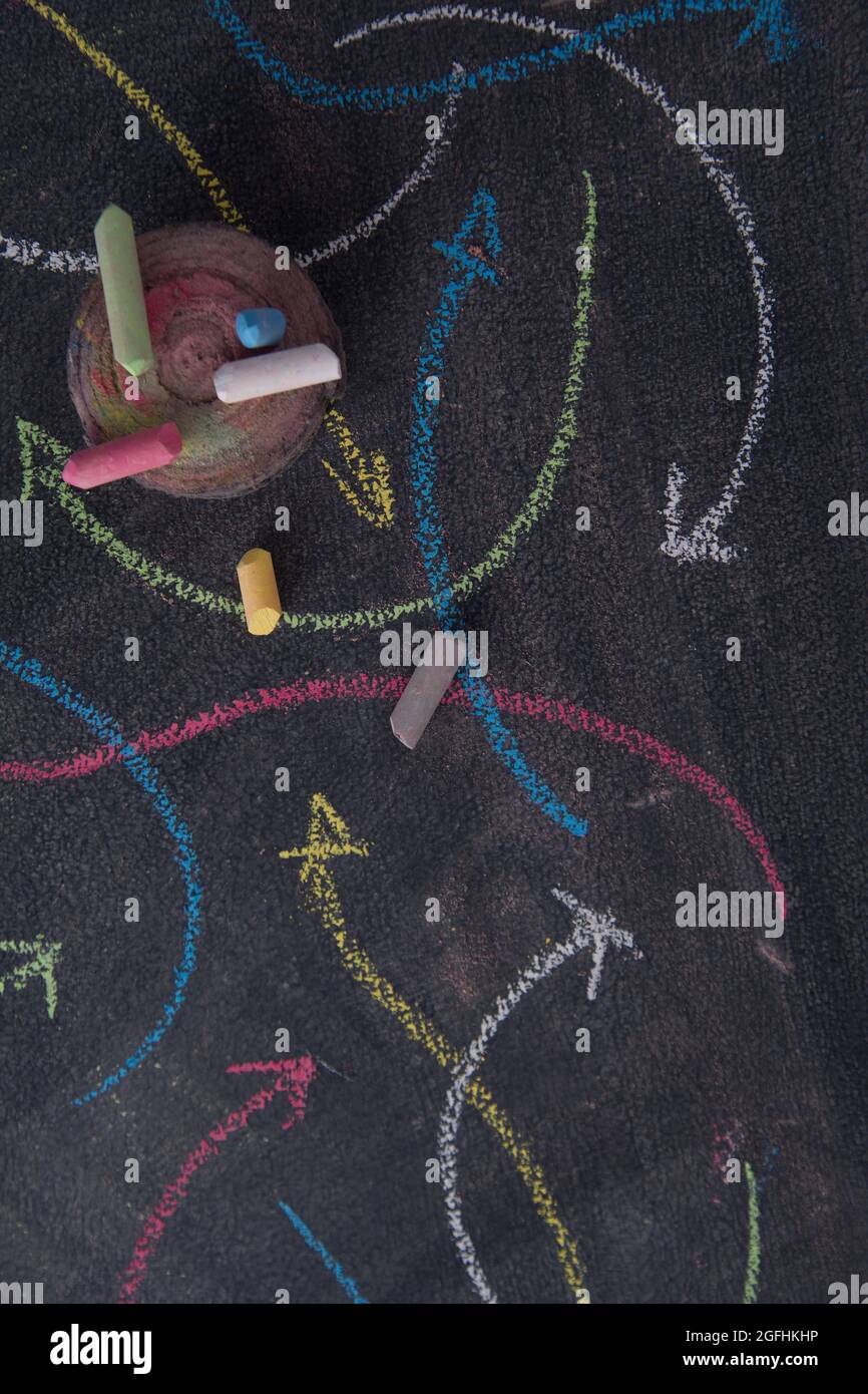Curved colored arrows drawn with chalk on blackboard Stock Photo - Alamy