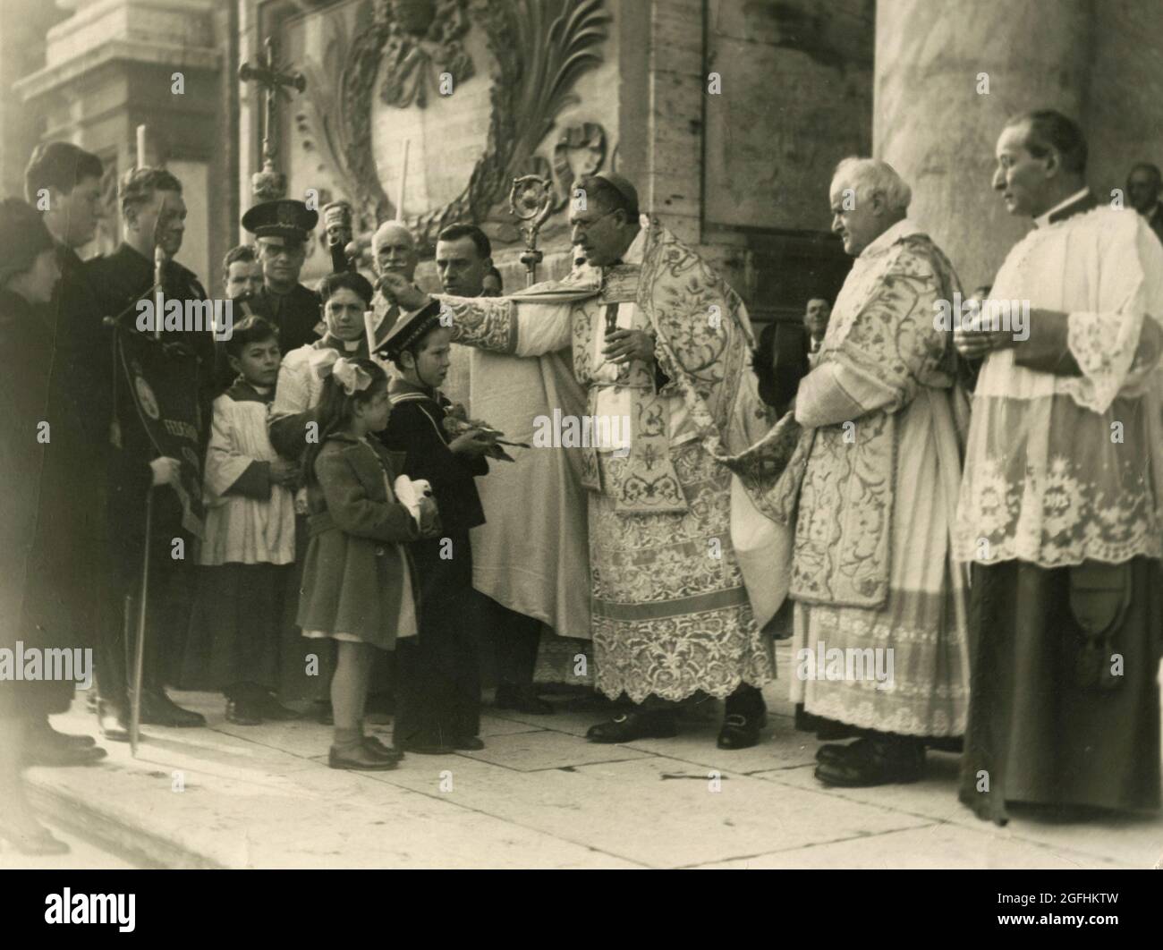 High Catholic Priest blessing the children out of Lateran Basilica ...