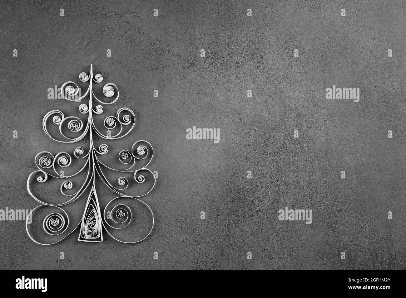 Christmas paper tree on grey background Stock Photo - Alamy