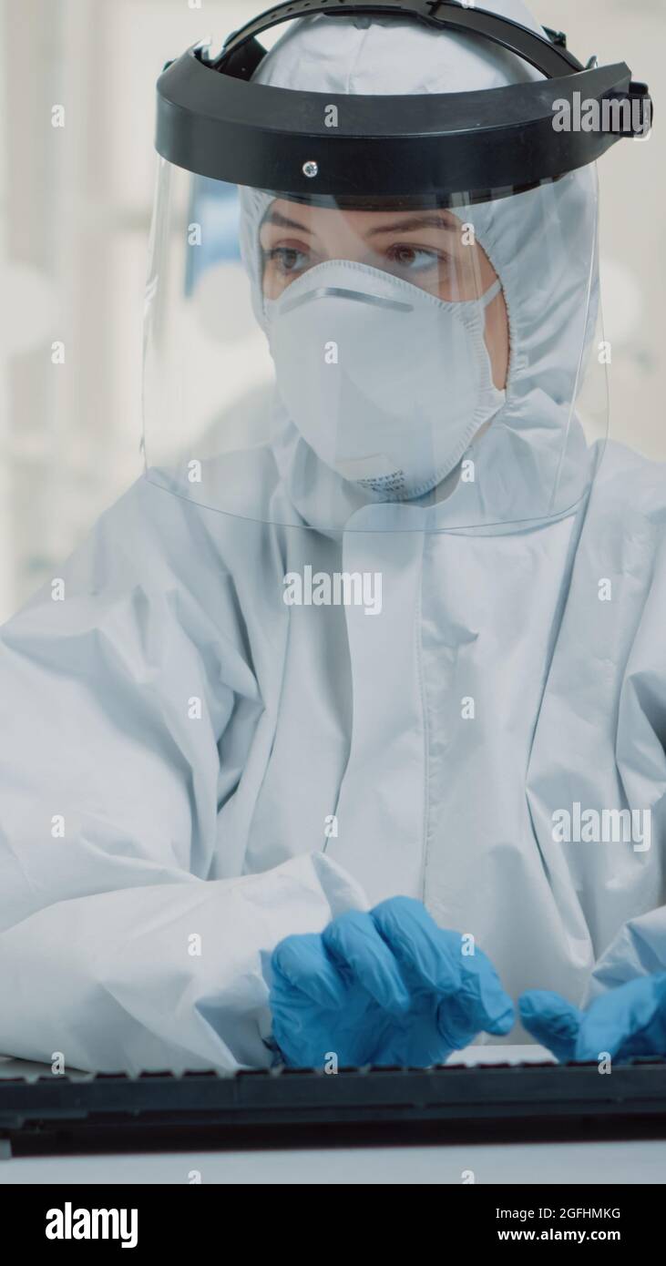 Dentistry specialist holding x ray while using computer at dental ...