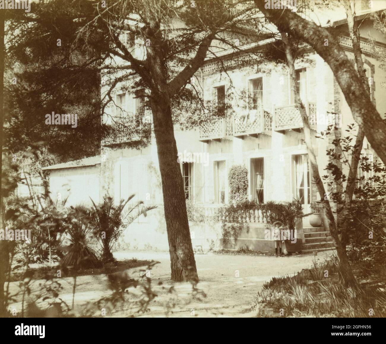 Elegant child in the garden of a villa, Italy 1908 Stock Photo - Alamy