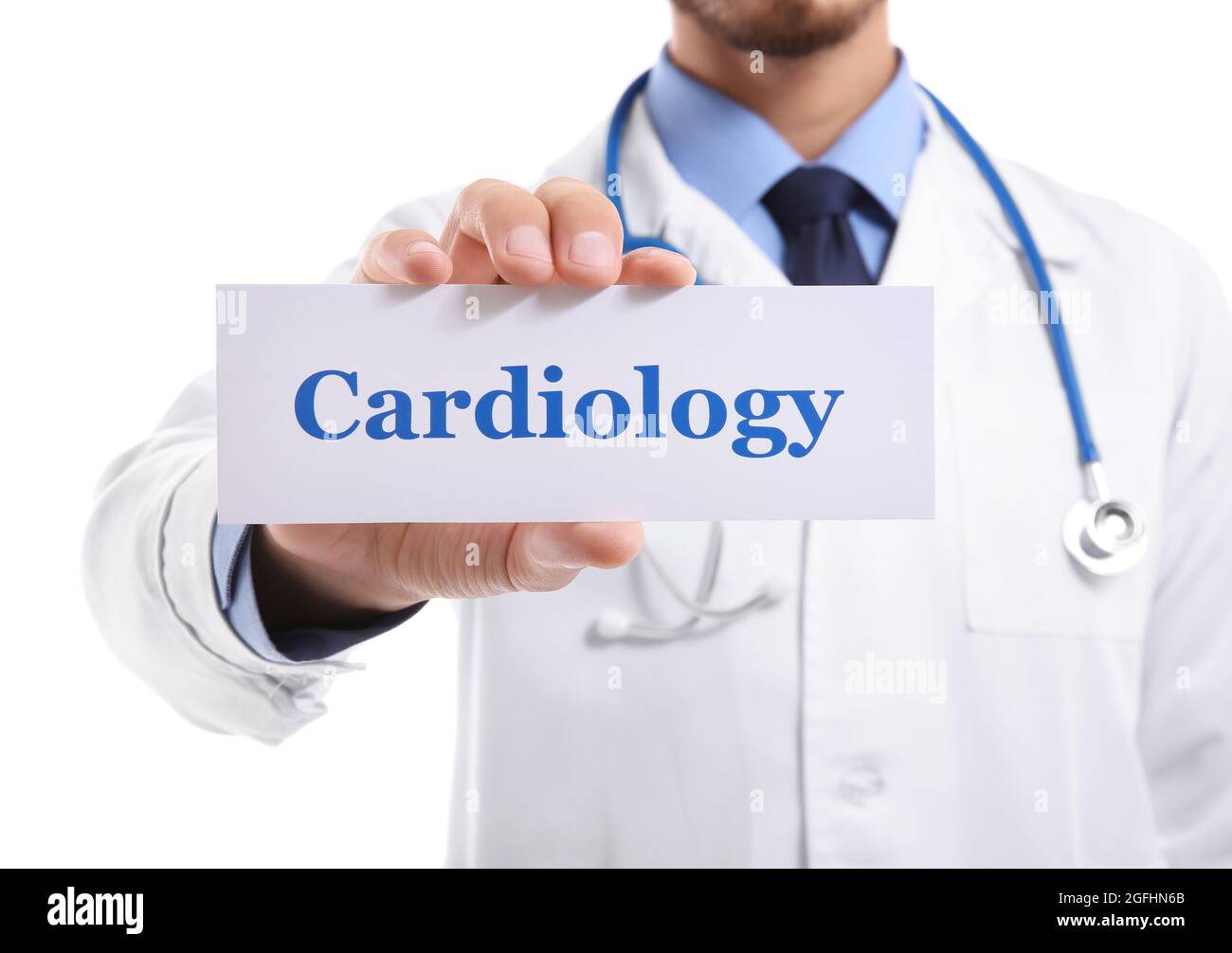 Male doctor holding paper with CARDIOLOGY text on white background ...