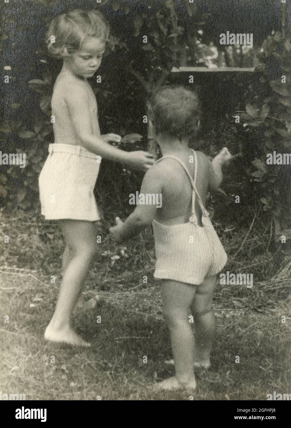 Two children playing outside, UK 1940s Stock Photo - Alamy
