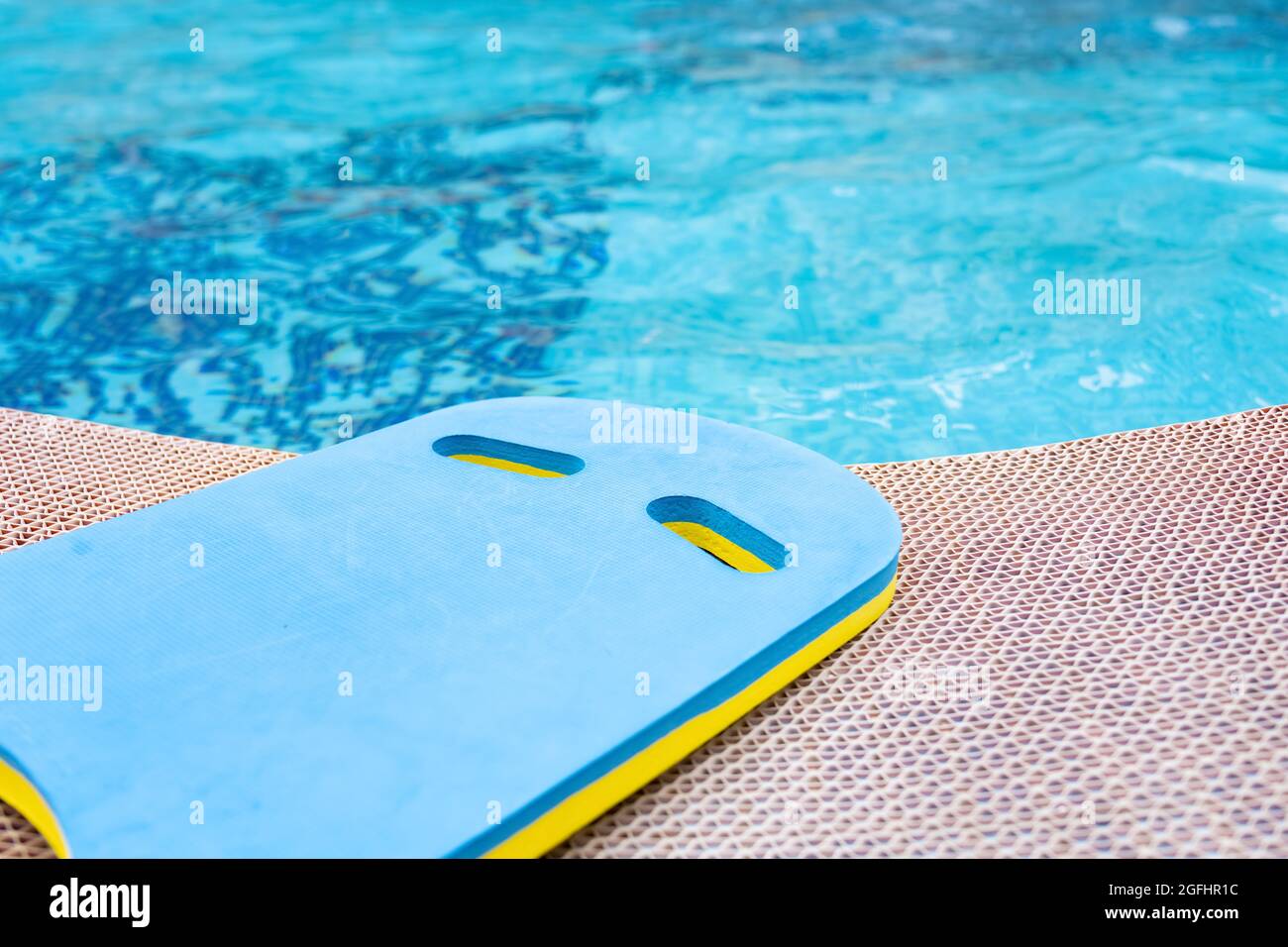 angle view blue floating pad near a swimming pool Stock Photo - Alamy